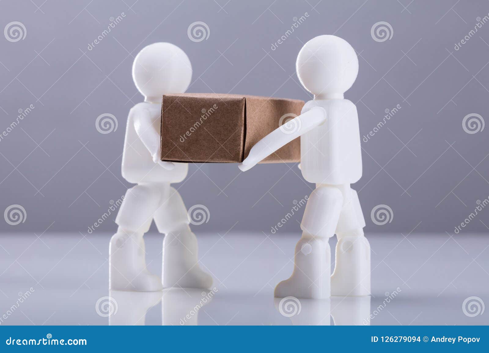 Close-up Two Human Figures Carrying Cardboard Box Stock Photo - Image ...