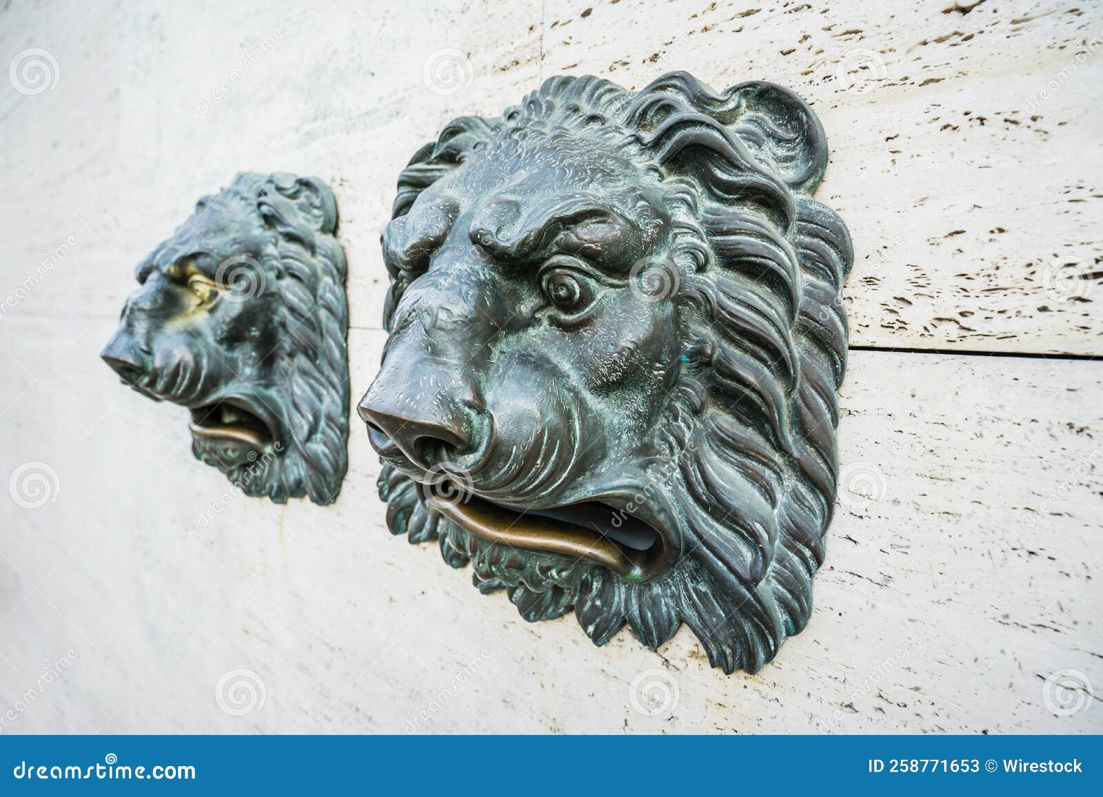 Close-up of Two Lion Heads on Wall Stock Image - Image of lion ...