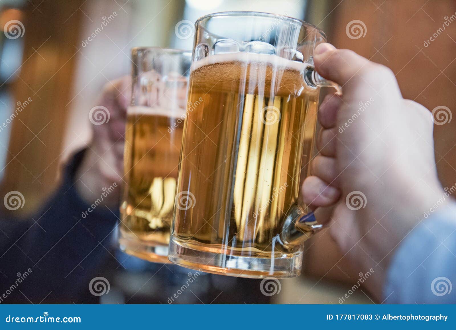 Two men toasting with beer stock image. Image of alcohol - 177817083