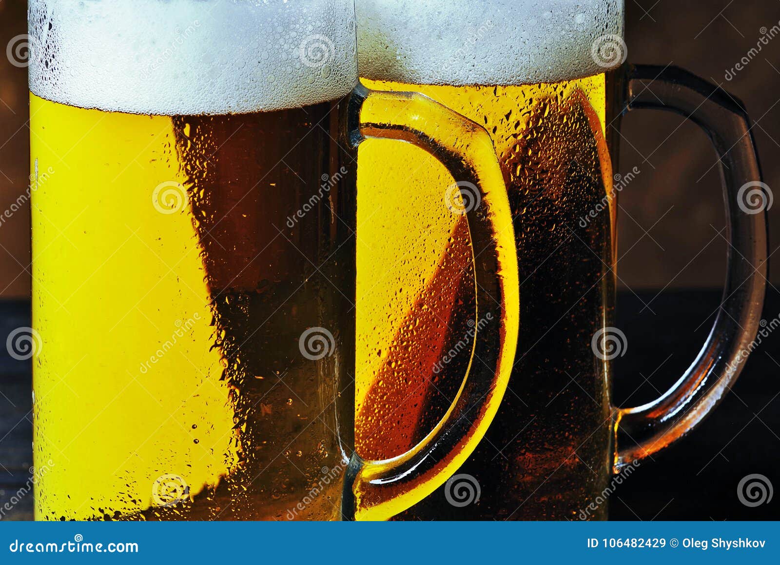 Close-up of Two Mugs of Beer. Stock Image - Image of drop, alcohol ...