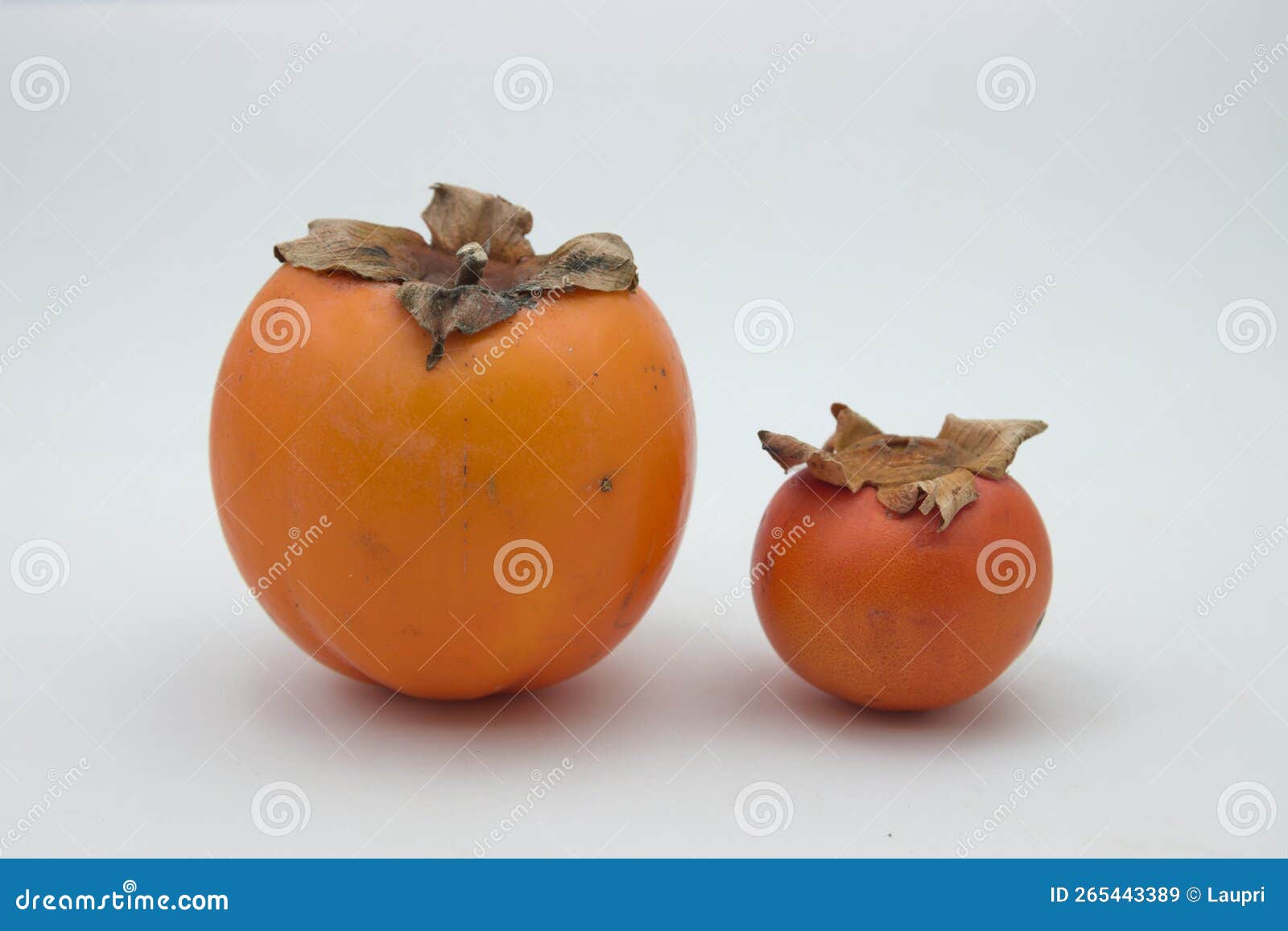 Close-up of Two Persimmon of Different Sizes on a White Background ...