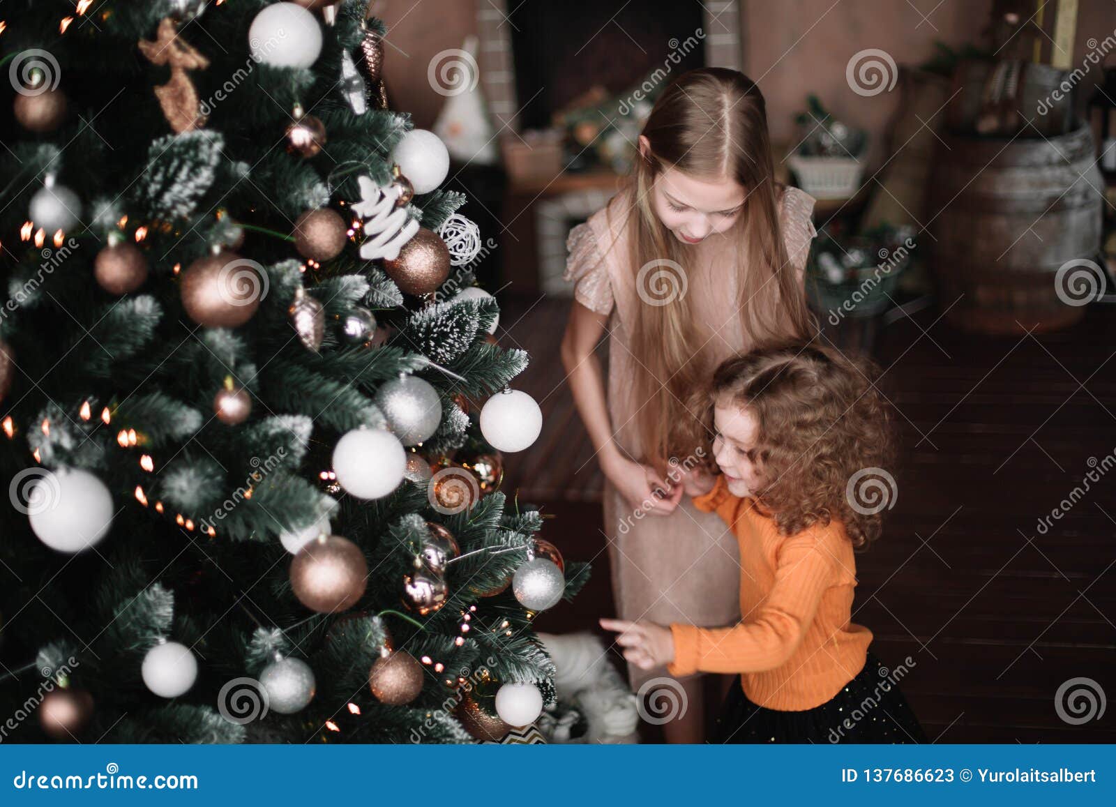 Close Up.two Sisters Standing by the Christmas Tree Stock Image - Image ...