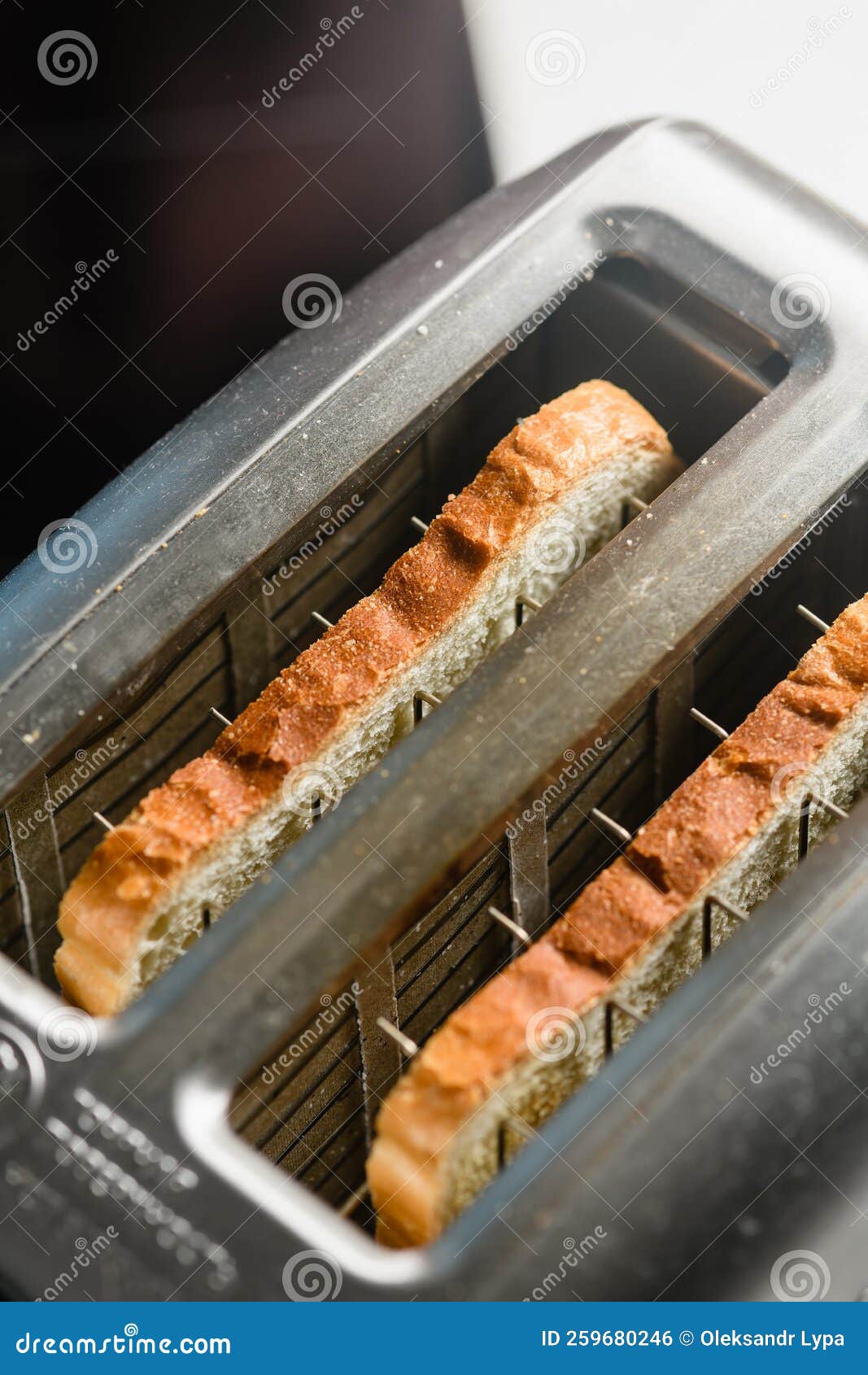 Close-up of Two Slices of Bread in Toaster Stock Photo - Image of ...