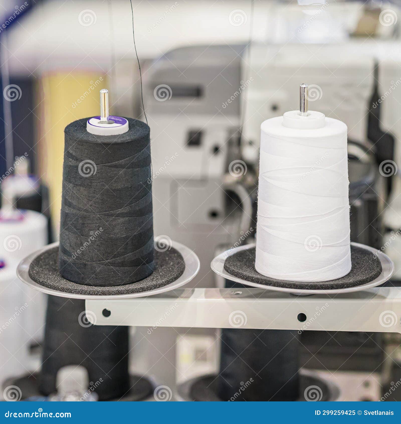 Close-up of Two Spools of Thread on Sewing Machine, Garment Factory ...