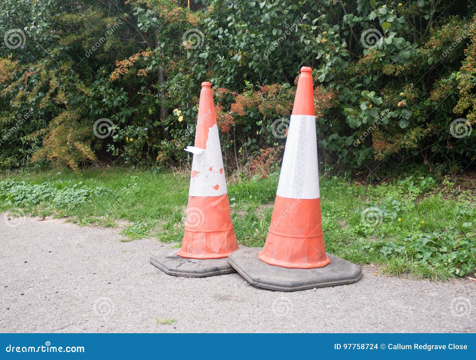 Close Up of Two Traffic Cones on Pavement Stock Photo - Image of road ...
