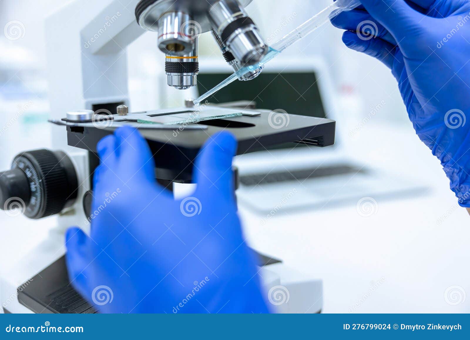 Close Up of Unrecognizable Doctor Examining of Test Sample Under the ...
