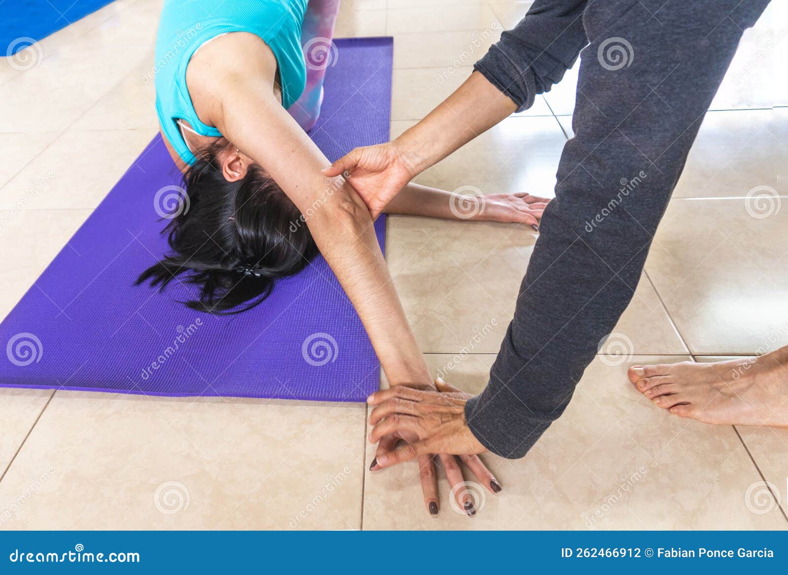Close-up of an Unrecognizable Female Instructor Helping a Student with ...