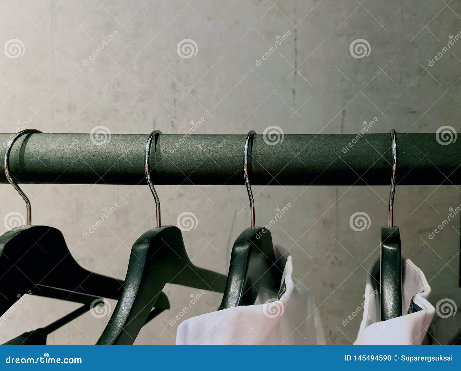 Upper Section of Cloth Hangers Inside the Wardrobe Stock Photo - Image ...