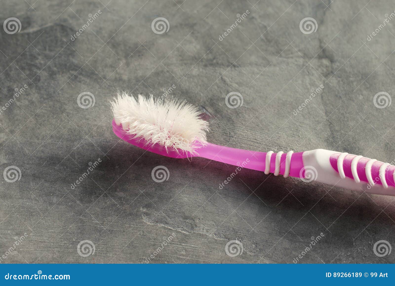 Close Up Used Pink Toothbrush with Cement Background. Stock Image ...