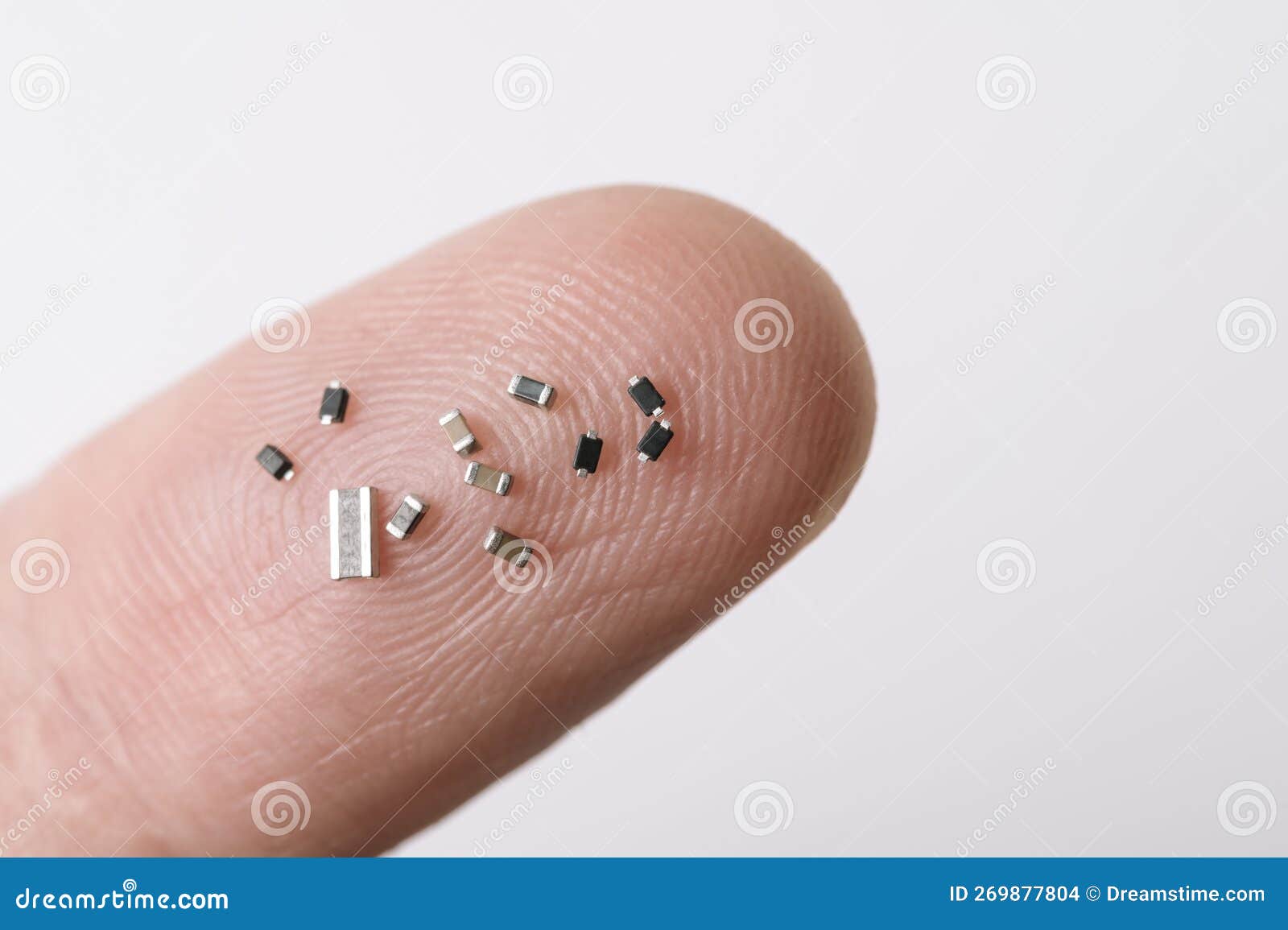 Close Up of Various Electronic Microchips on Human Finger Stock Photo ...