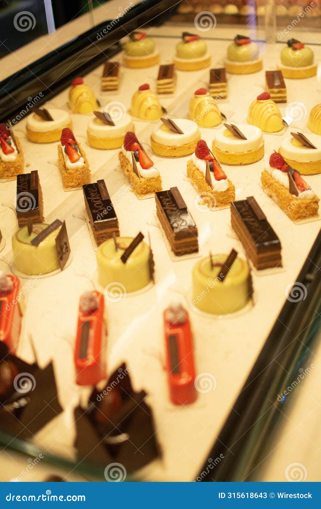 Close-up of Various Sweets and Pastries Displayed on Shelves in a ...
