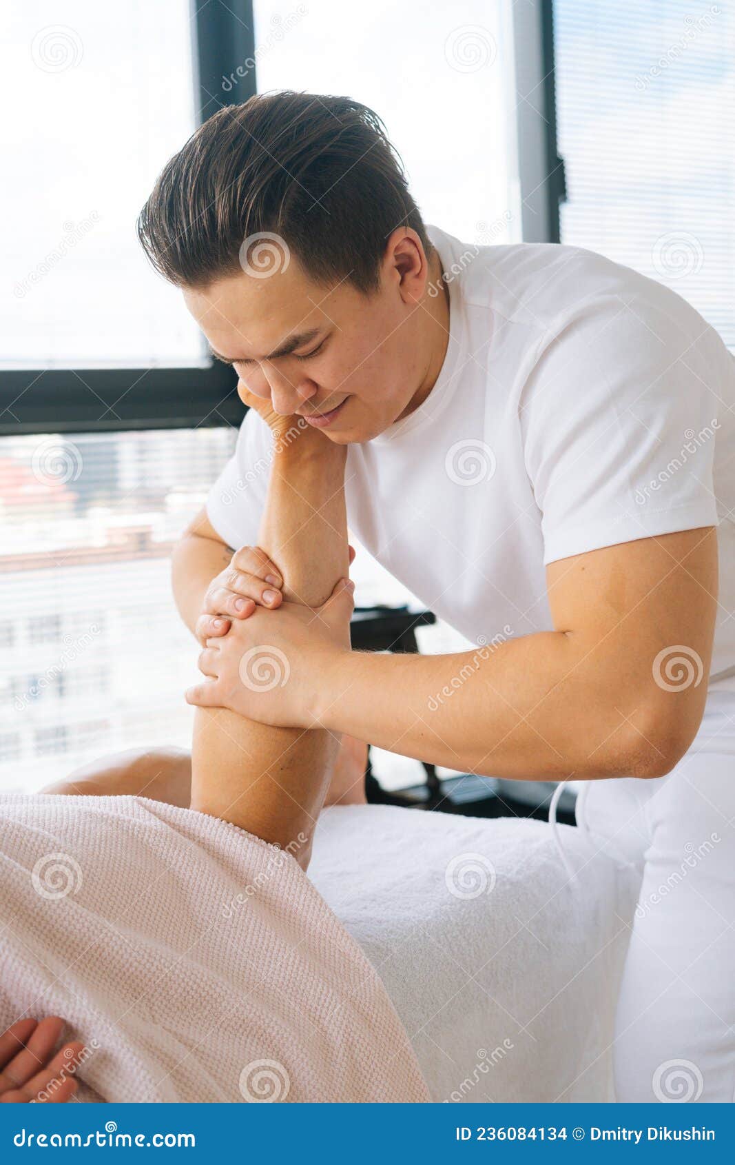 Close Up Vertical Shot Of Professional Male Masseur With Strong Hands