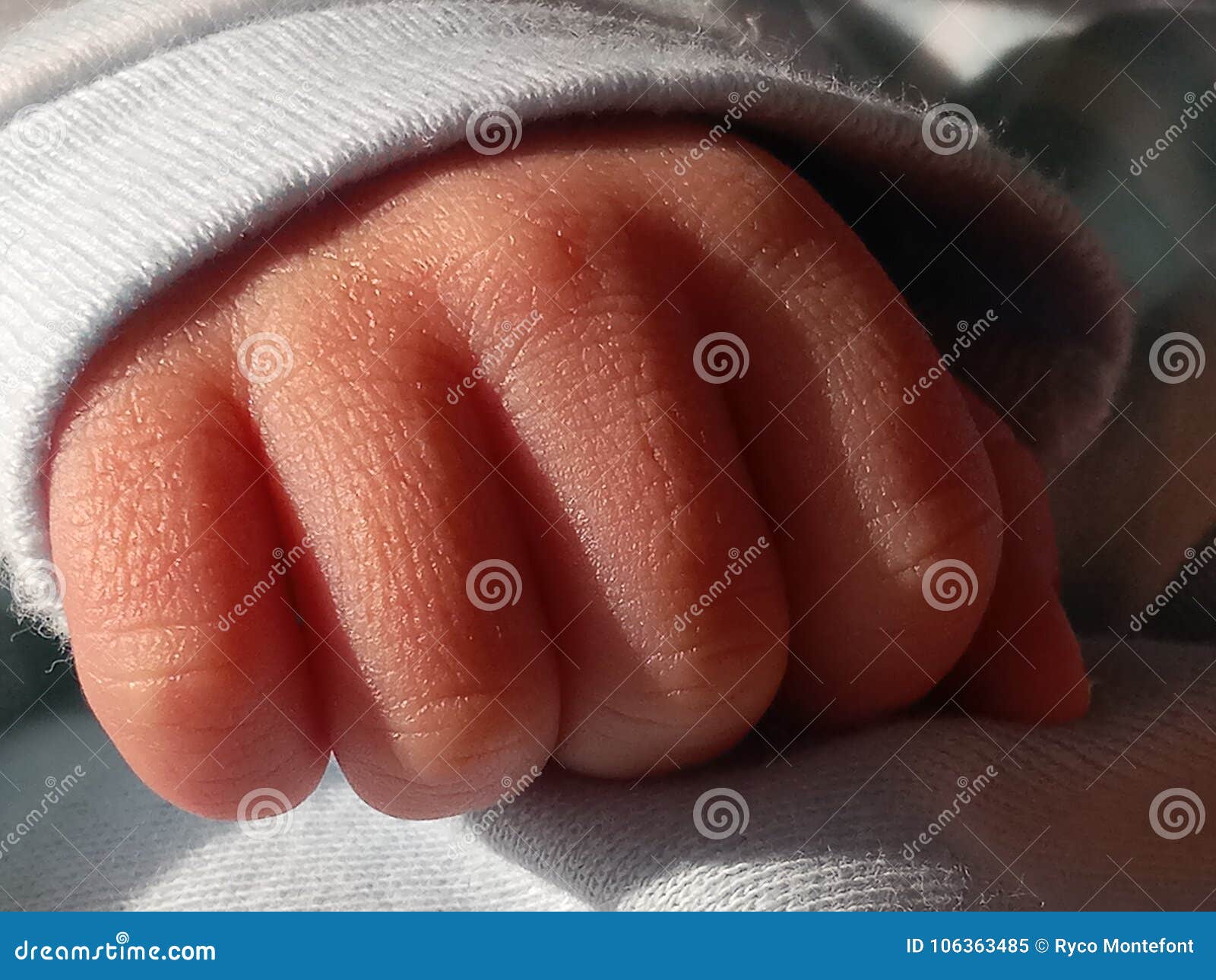 Babys hand in a fist stock image. Image of view, close - 106363485