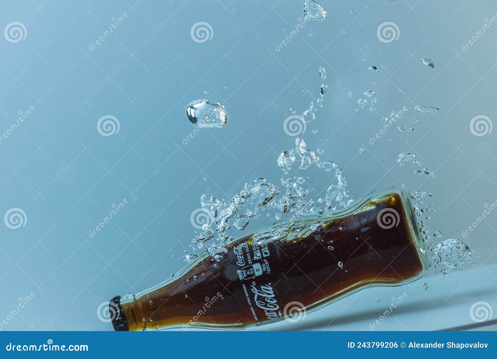 Close Up View of Bottle of Coca Cola Falling into Water Isolation on ...