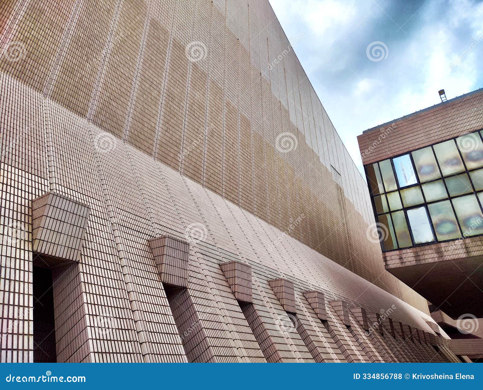A Close-up View of a Brick-patterned Building Facade with an ...