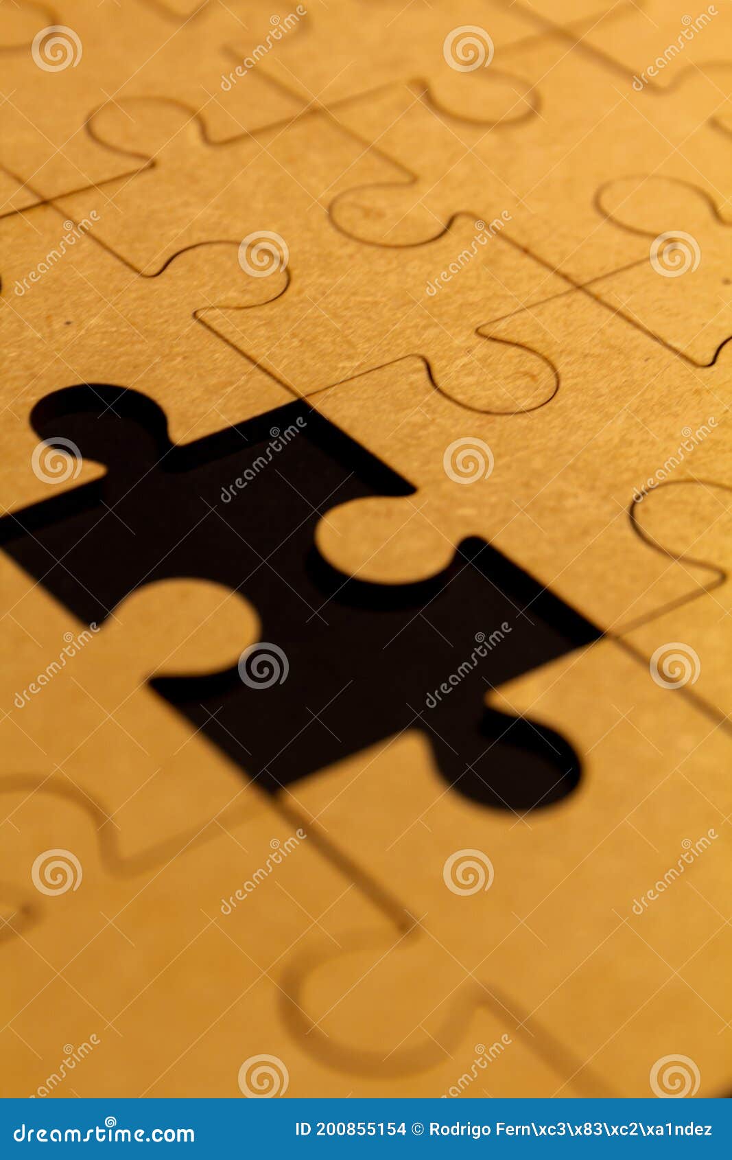 Close Up View of a Brown Puzzle with One Piece Missing Stock Photo ...