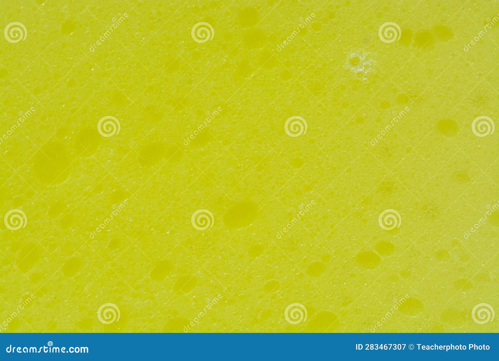 A Close-up View of Bubbles on Yellow Washing Liquid, Creating a Bubbly ...