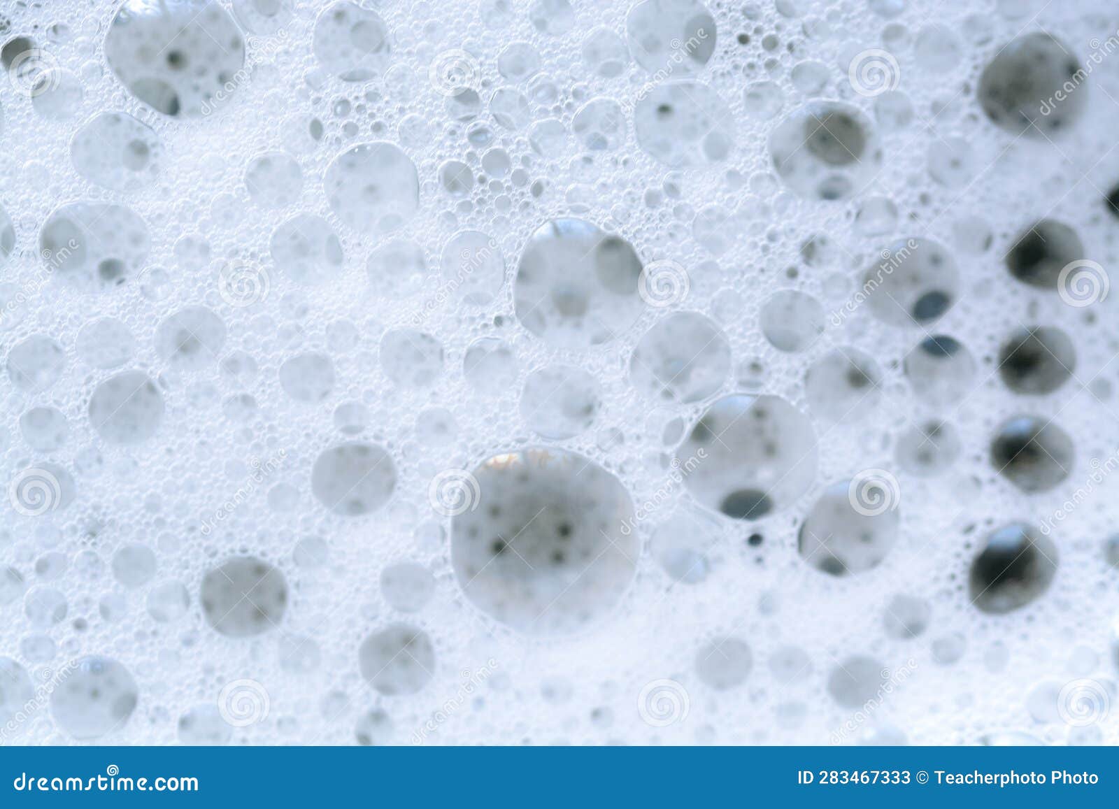 A Close-up View of Bubbles on Yellow Washing Liquid, Creating a Bubbly ...
