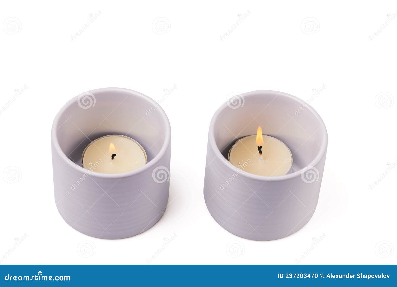 Close Up View of Burning Candles in White Candlesticks Isolated on ...