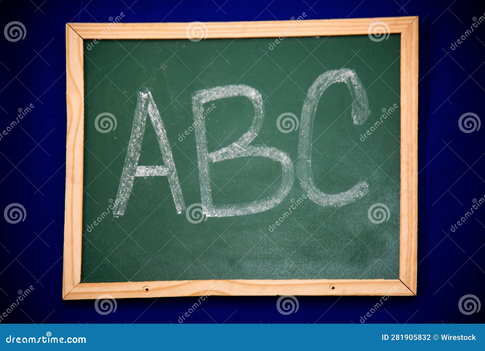 Close-up View of a Chalkboard with a Stylized ABC Written in White ...