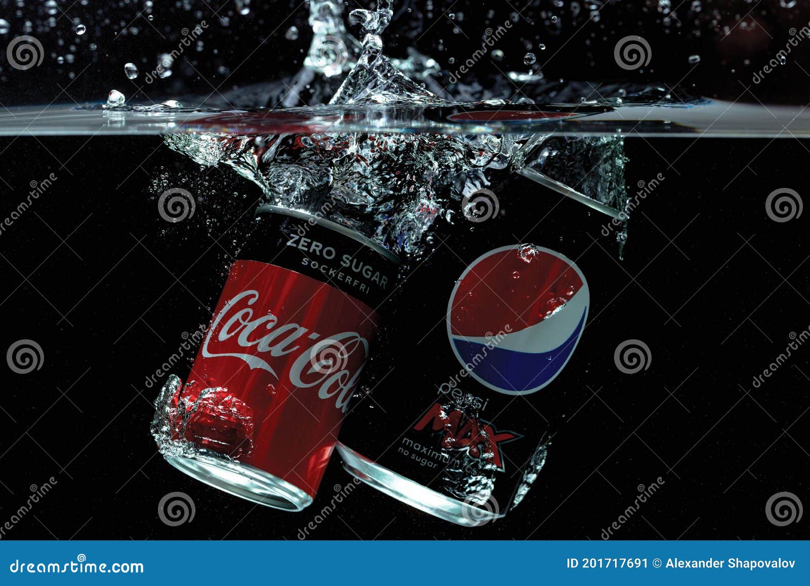 Close Up View of Coca and Pepsi Falling in Water on Black Background ...