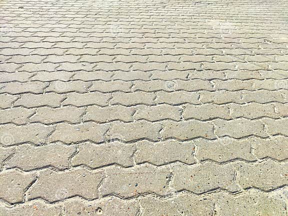 A Close-up View of a Concrete Pavement Surface, Showcasing Interlocking ...