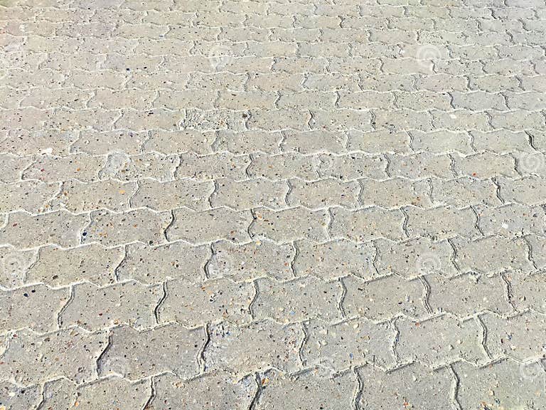A Close-up View of a Concrete Pavement Surface, Showcasing Interlocking ...