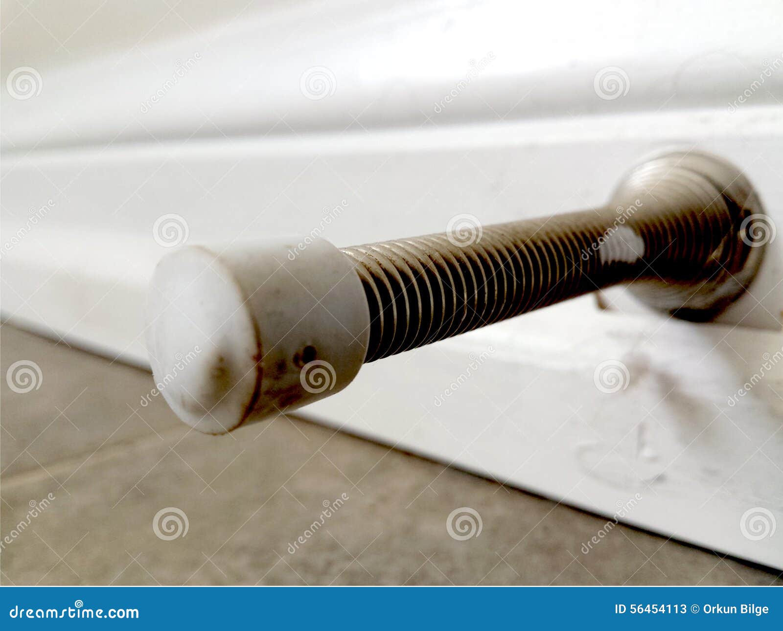 Door Stop. Door Spring Stopper On The Street. Door Stop Spring Mounted ...