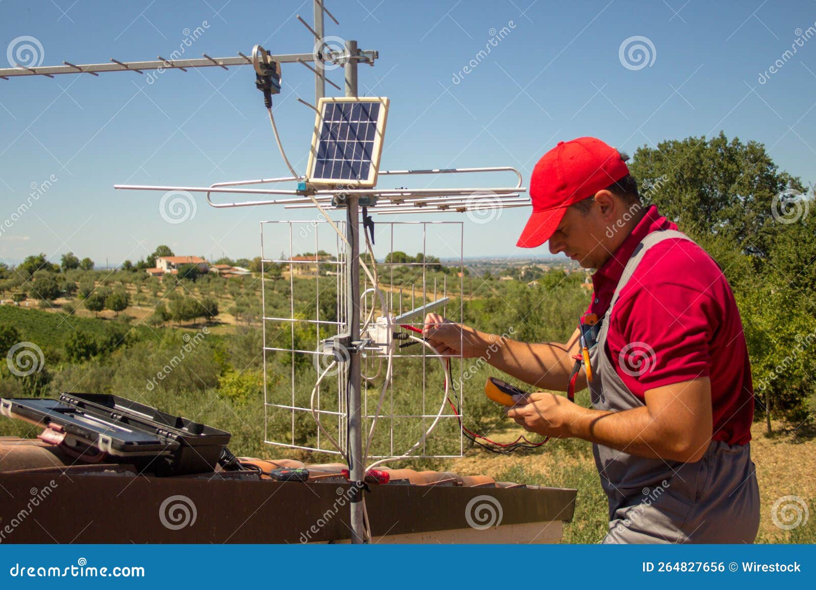 Close-up View of an Electrician Working on a Structure with a Solar ...