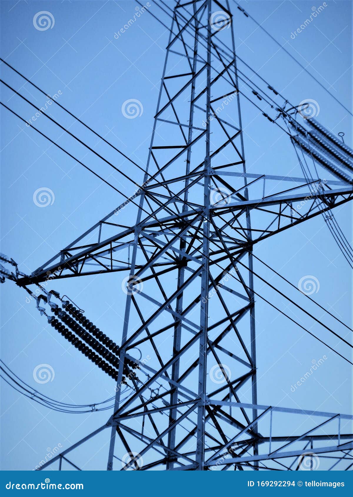 Close Up Electricity Pylon Against Blue Sky Stock Photo - Image of ...