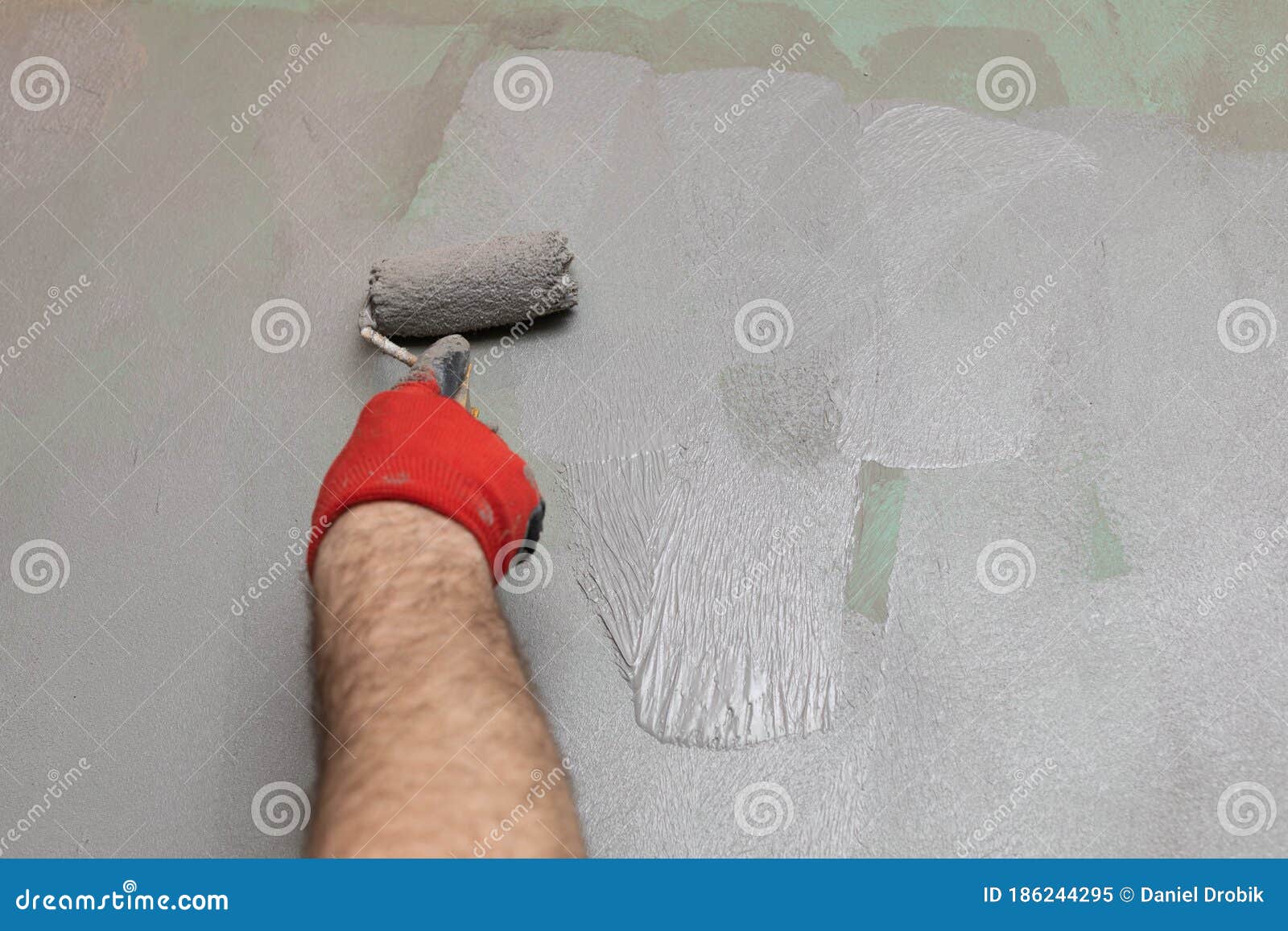 A Close-up View of an Experienced Construction Worker Applying Damp ...