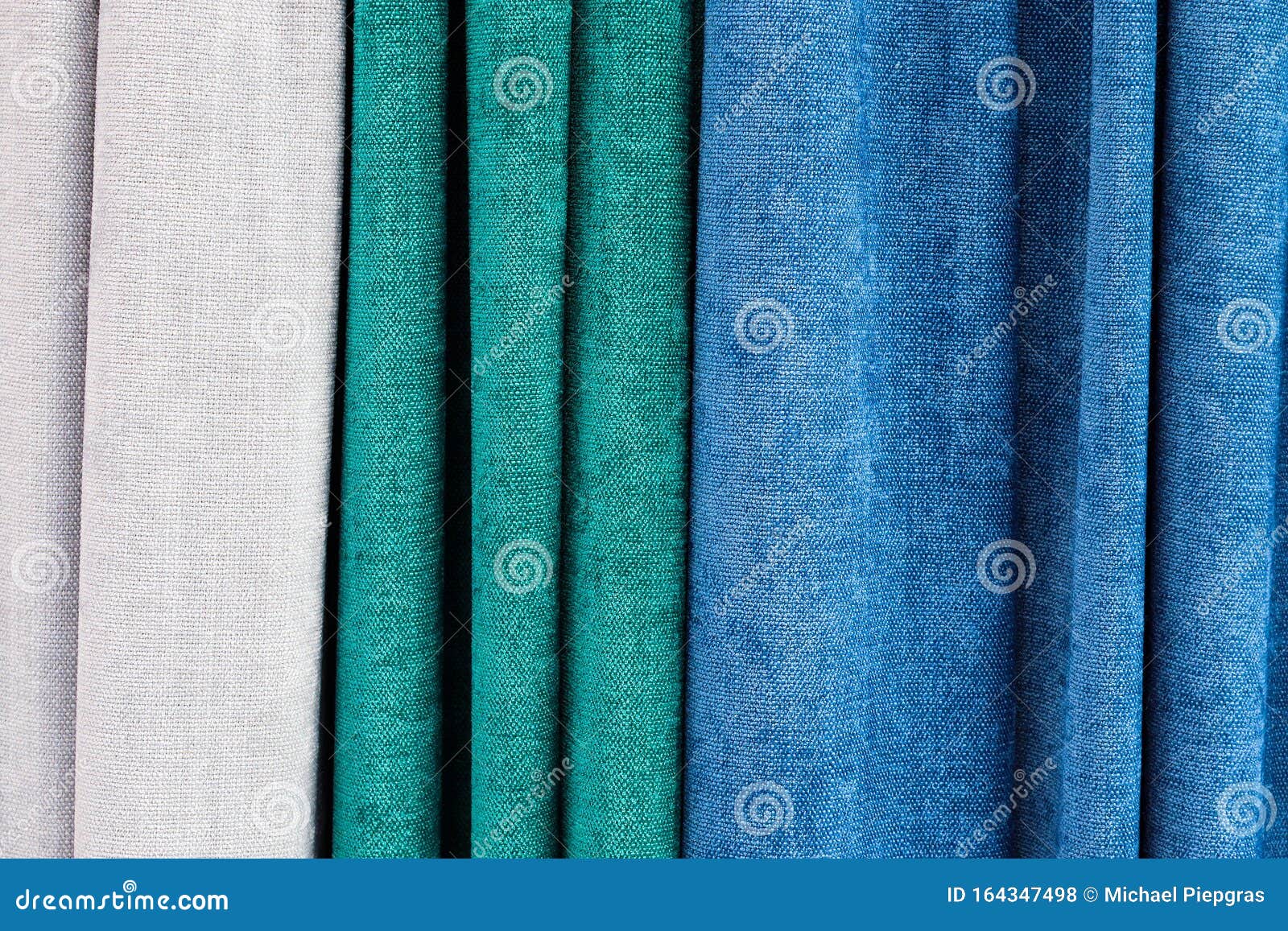 Close Up View On Folded Cloth And Fabric Textures In Different Colors ...