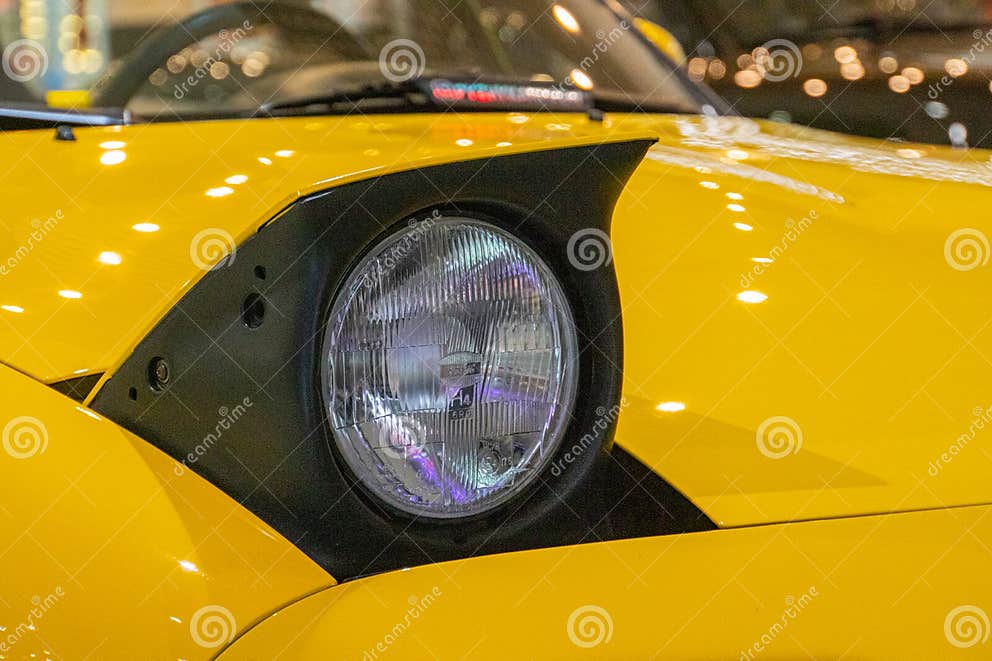 A Close-up View of the Front Section of a Yellow Racing Car Shows the ...