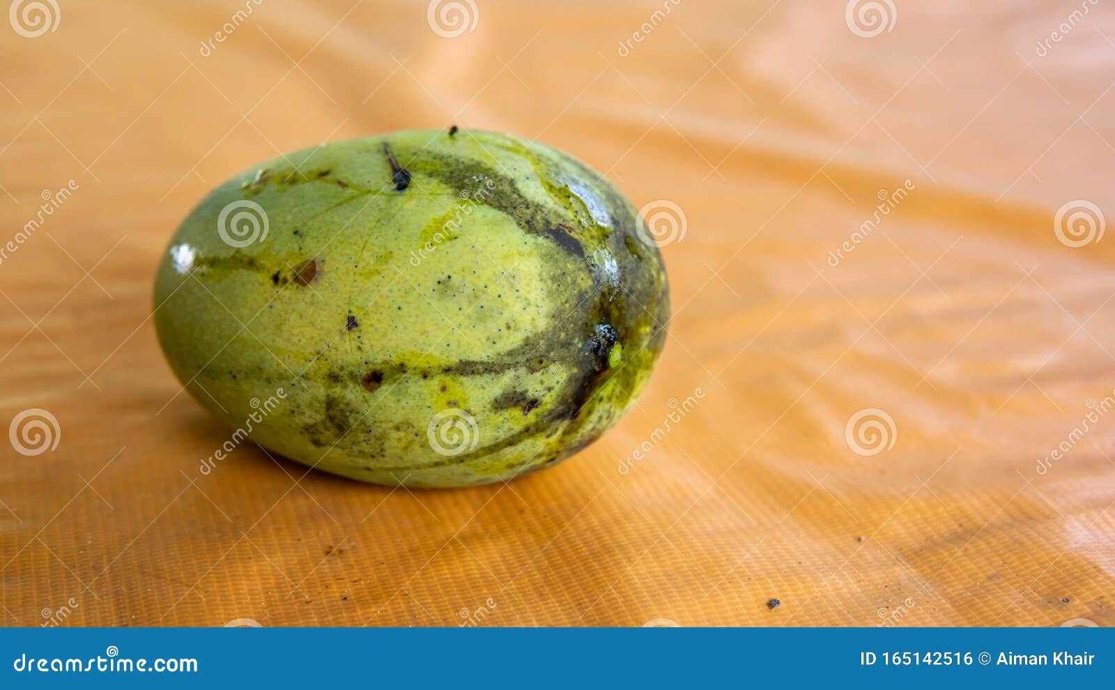 Close Up View of Fully Ripped Mango on a Orange Table Background Stock ...