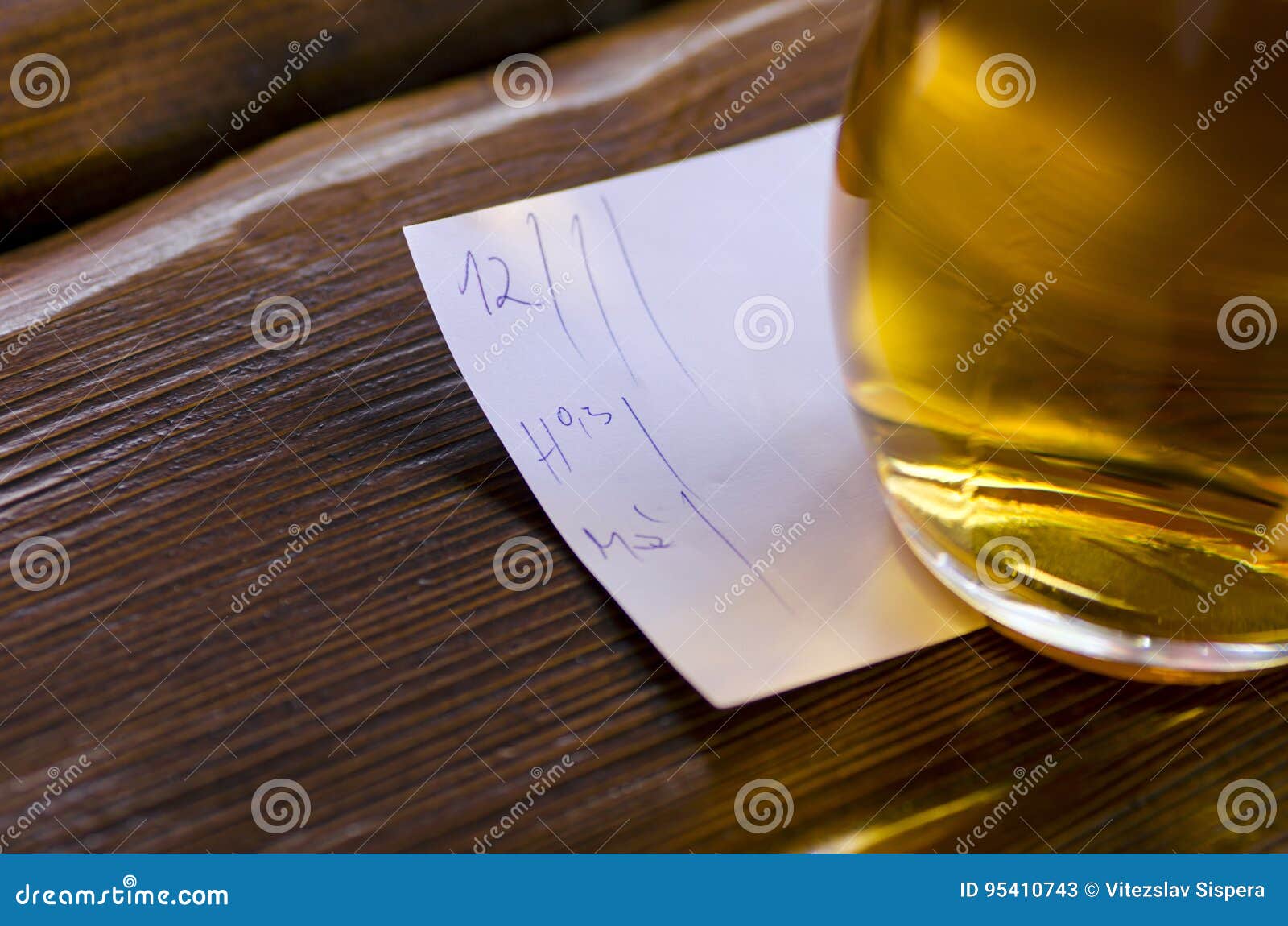 Close-up View of a Glass of Beer with a Bill Lying on a Table in Stock ...