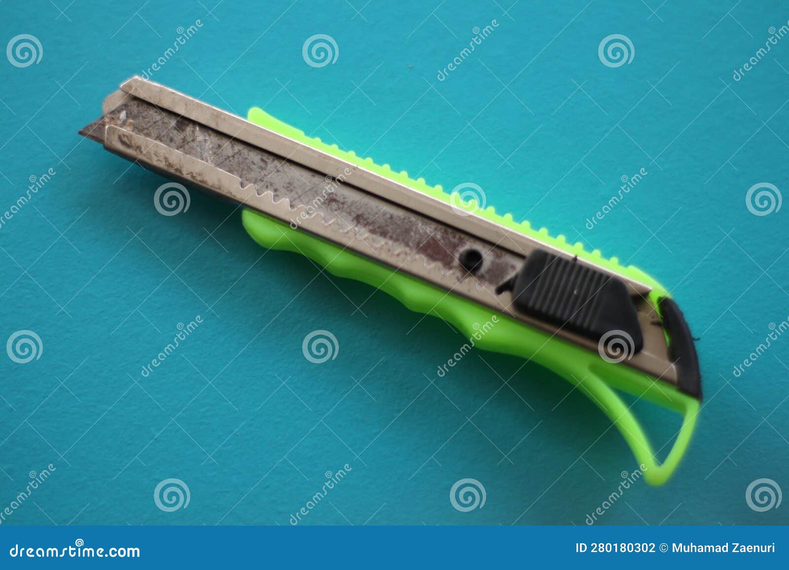 Close Up View of Green Cardboard Cutter Stock Photo - Image of trigger ...