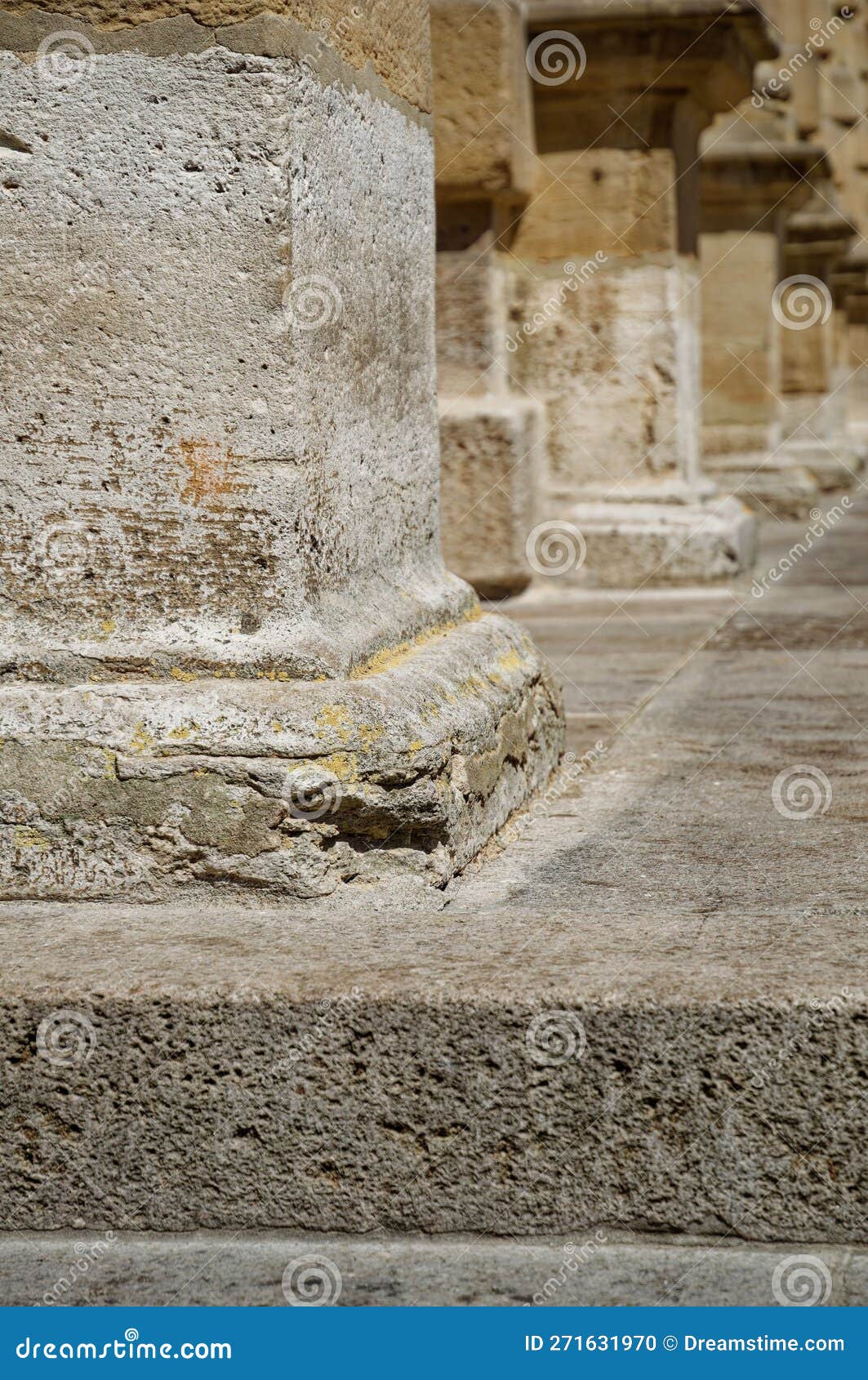 Close-up View of a Grey Stone Pillar Set at the Base of an Aisle in a ...