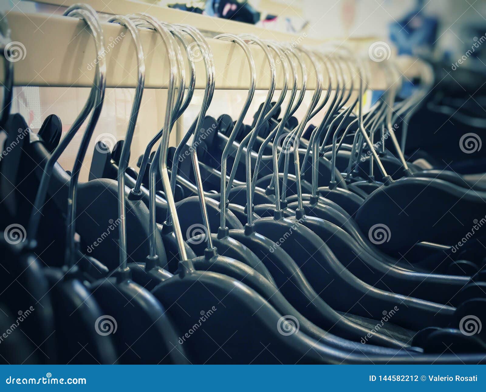 Close-up View of a Group of Clothes Hangers Hanging Stock Photo - Image ...
