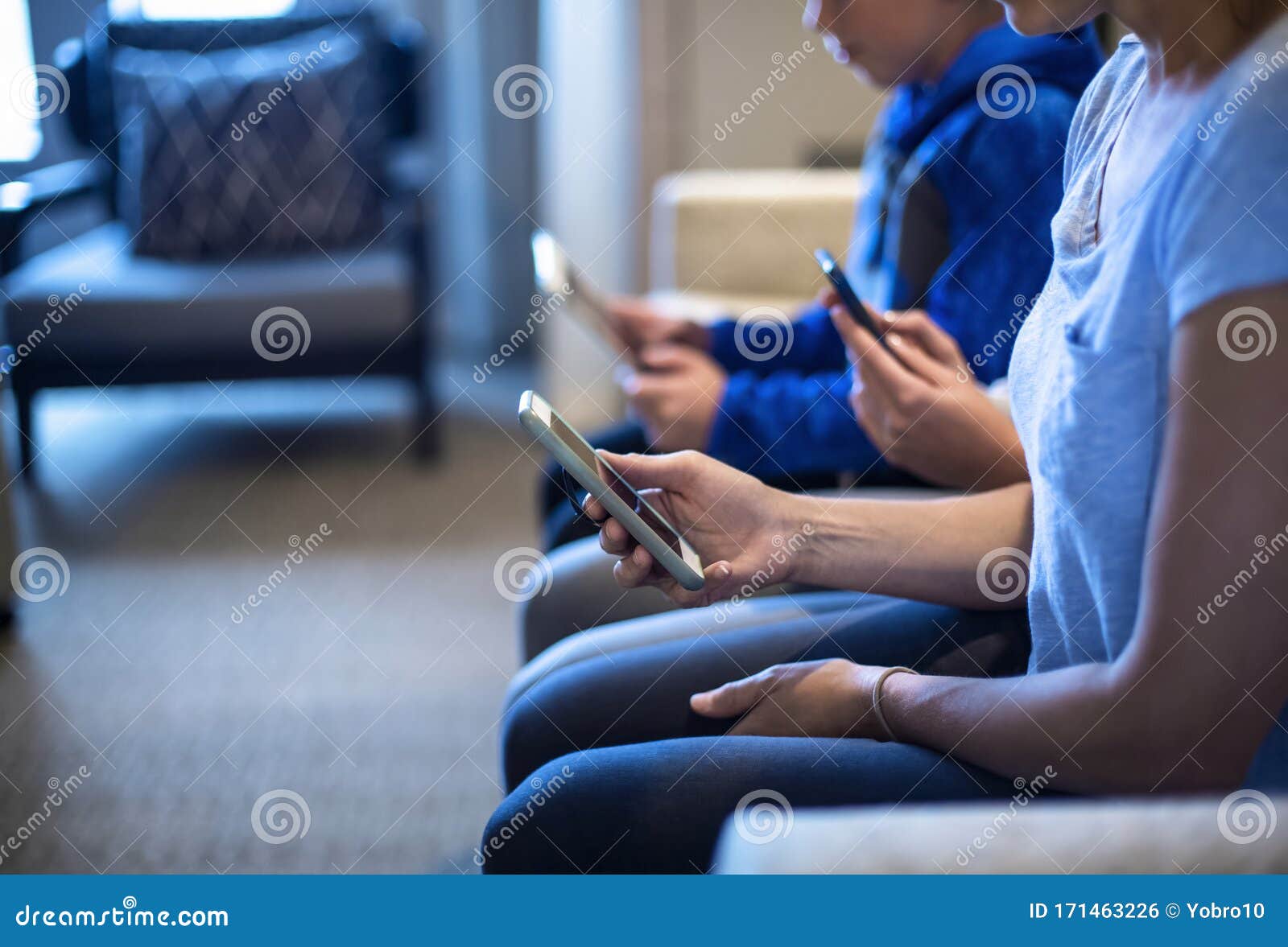 Group of People Using Their Smart Phones and Tablet Devices Together ...