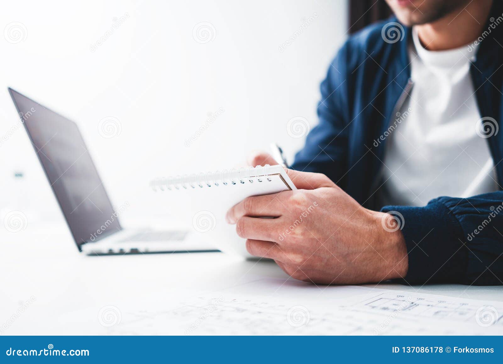 Close Up View of Hand Hold Notepad of Businessman while Working at ...