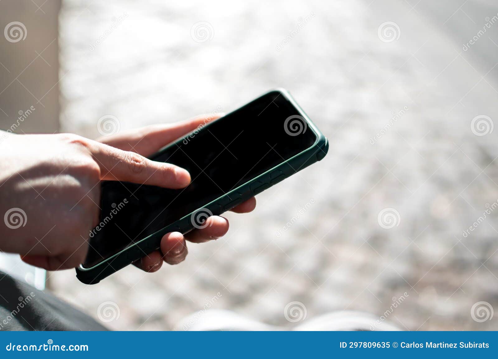 Close Up View of Hands Using Cell Phone with Body Seated Background on ...
