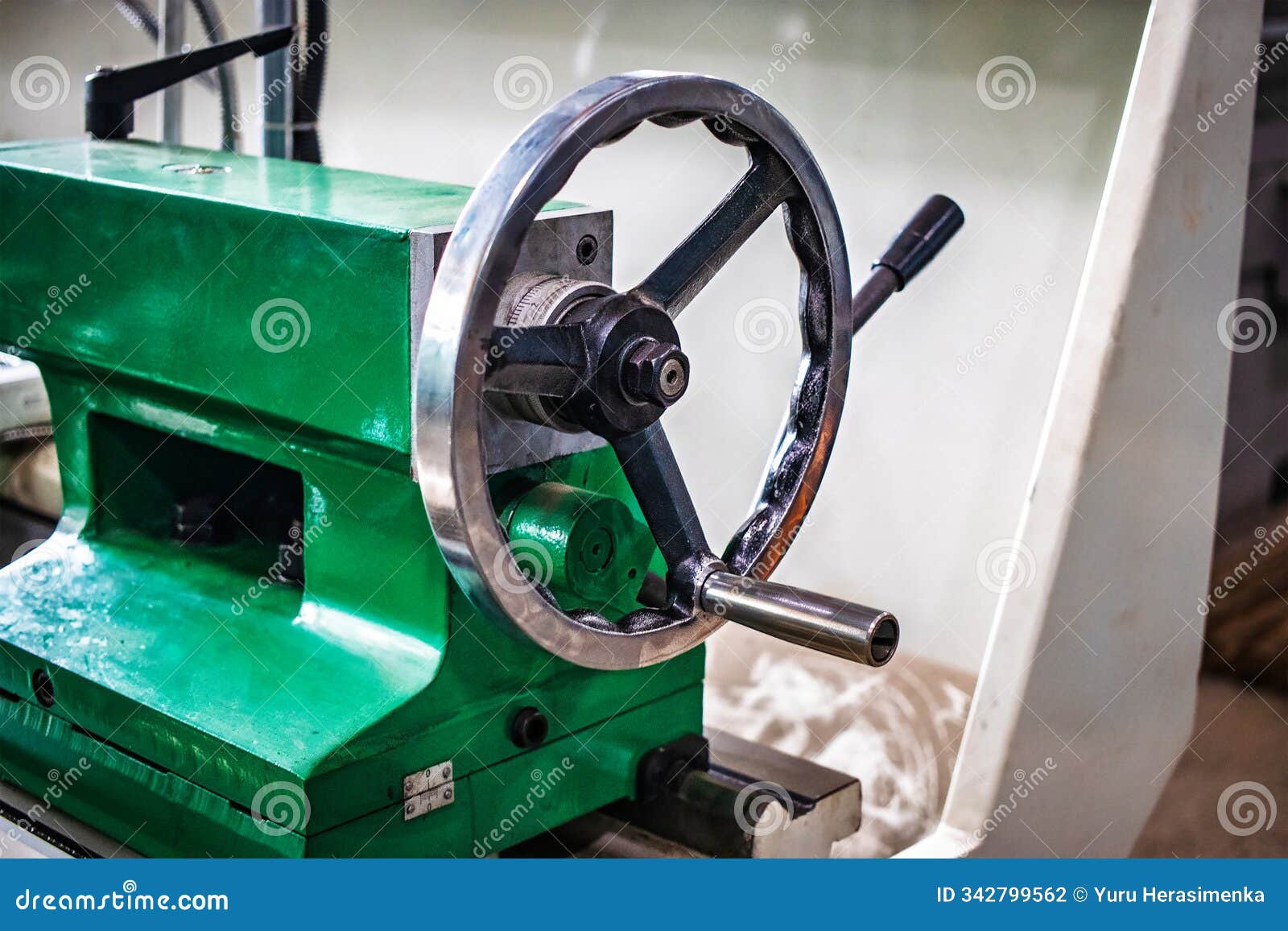 A Close-up View of a Lathe Machine in a Factory Setting, Highlighting ...