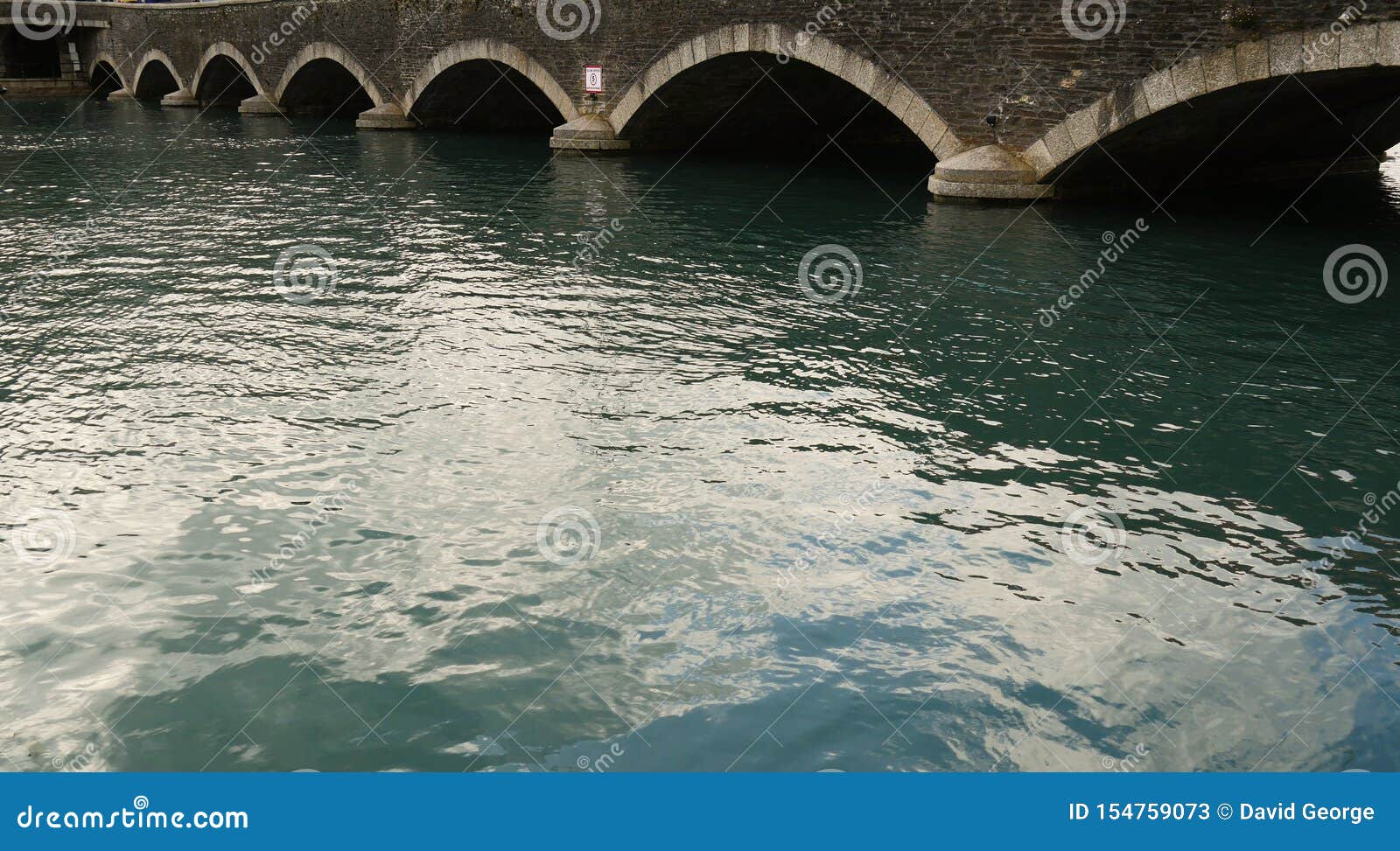 High Tide at the Harbour, Looe Bridge, Cornwall, UK Stock Image - Image ...
