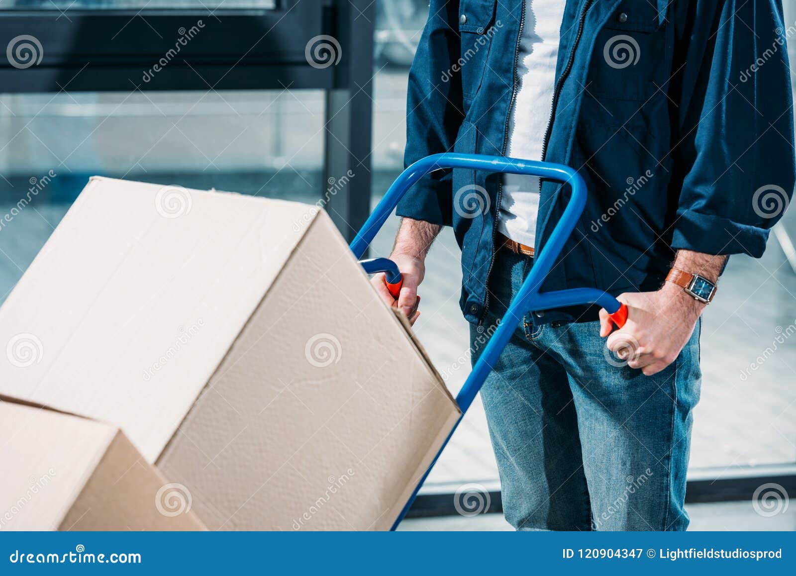 Close-up View of Man Pushing Hand Truck Stock Image - Image of working ...