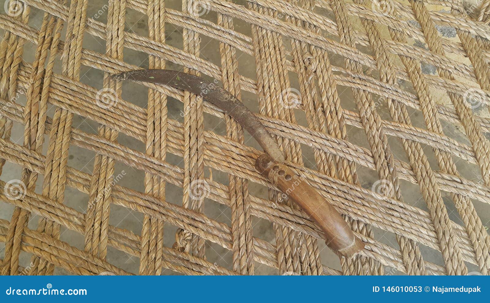 Close-up View of an Old Sickle Reaping-hook on the Bed Surface Stock ...