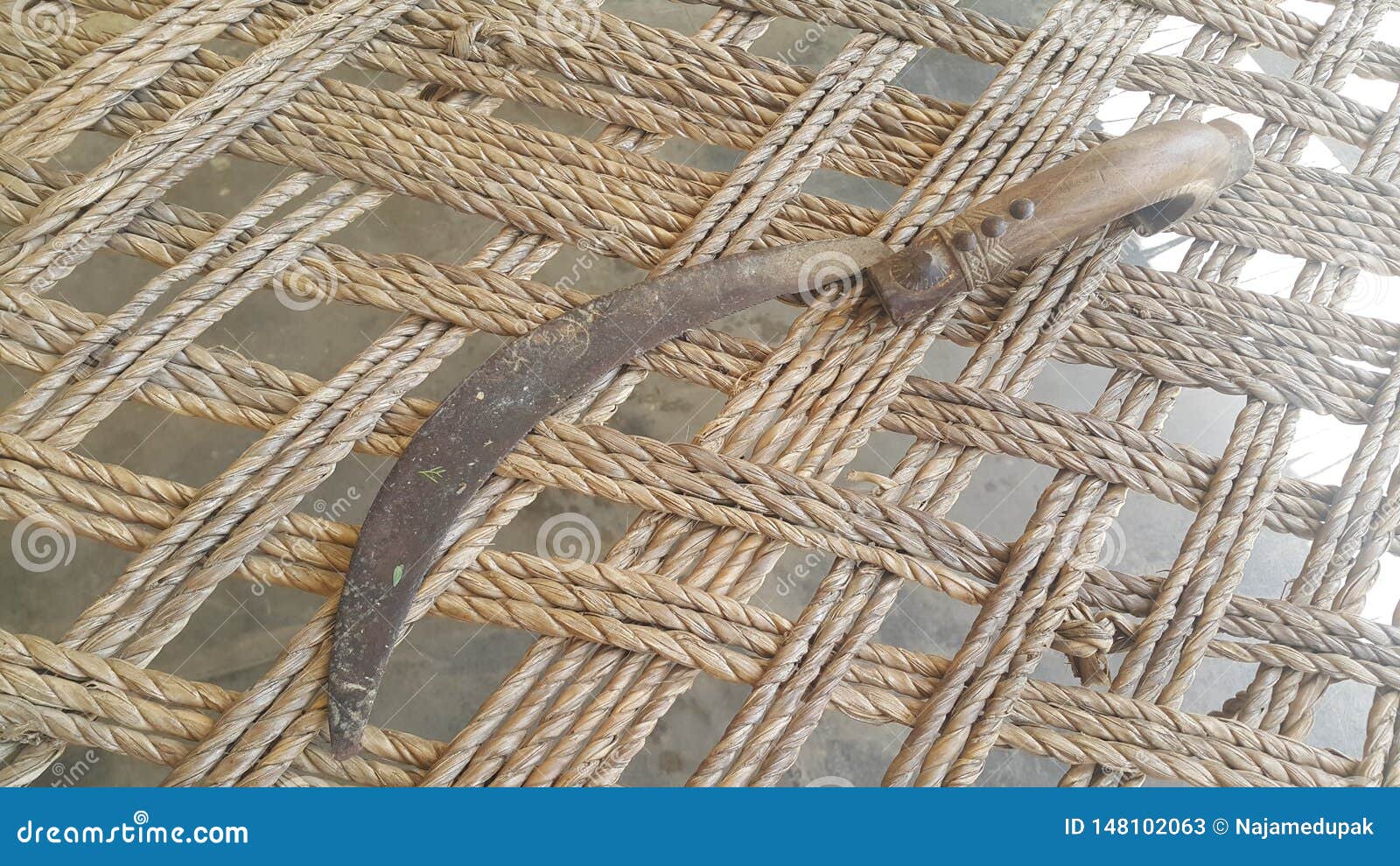 Close-up View of an Old Sickle & X28;reaping-hook& X29; on the Bed ...