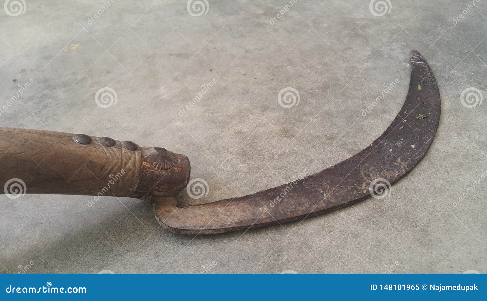 Close-up View of an Old Sickle & X28;reaping-hook& X29; on the Concrete ...