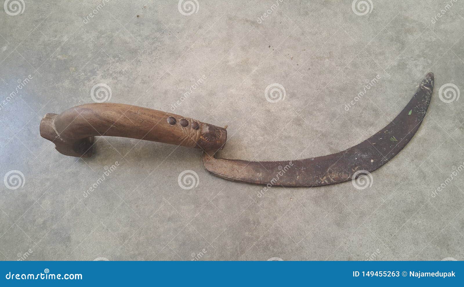 Close-up View of an Old Sickle & X28;reaping-hook& X29; on the Concrete ...