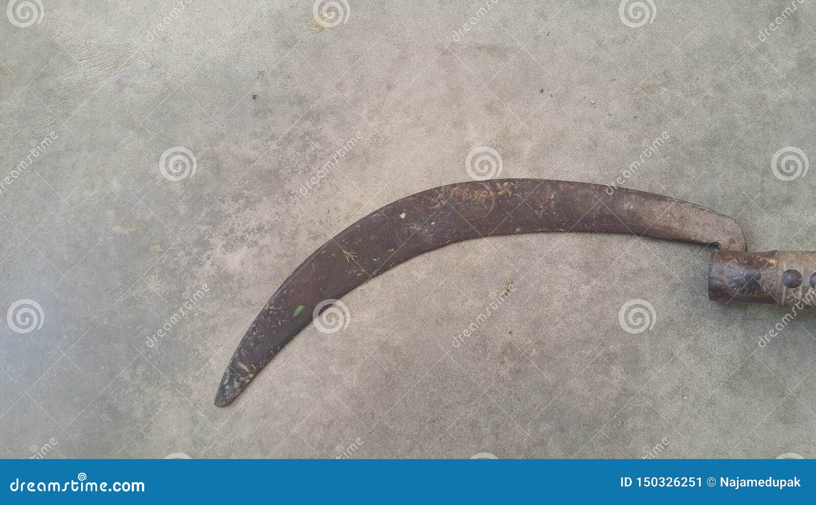 Close-up View of an Old Sickle & X28;reaping-hook& X29; on the Concrete ...