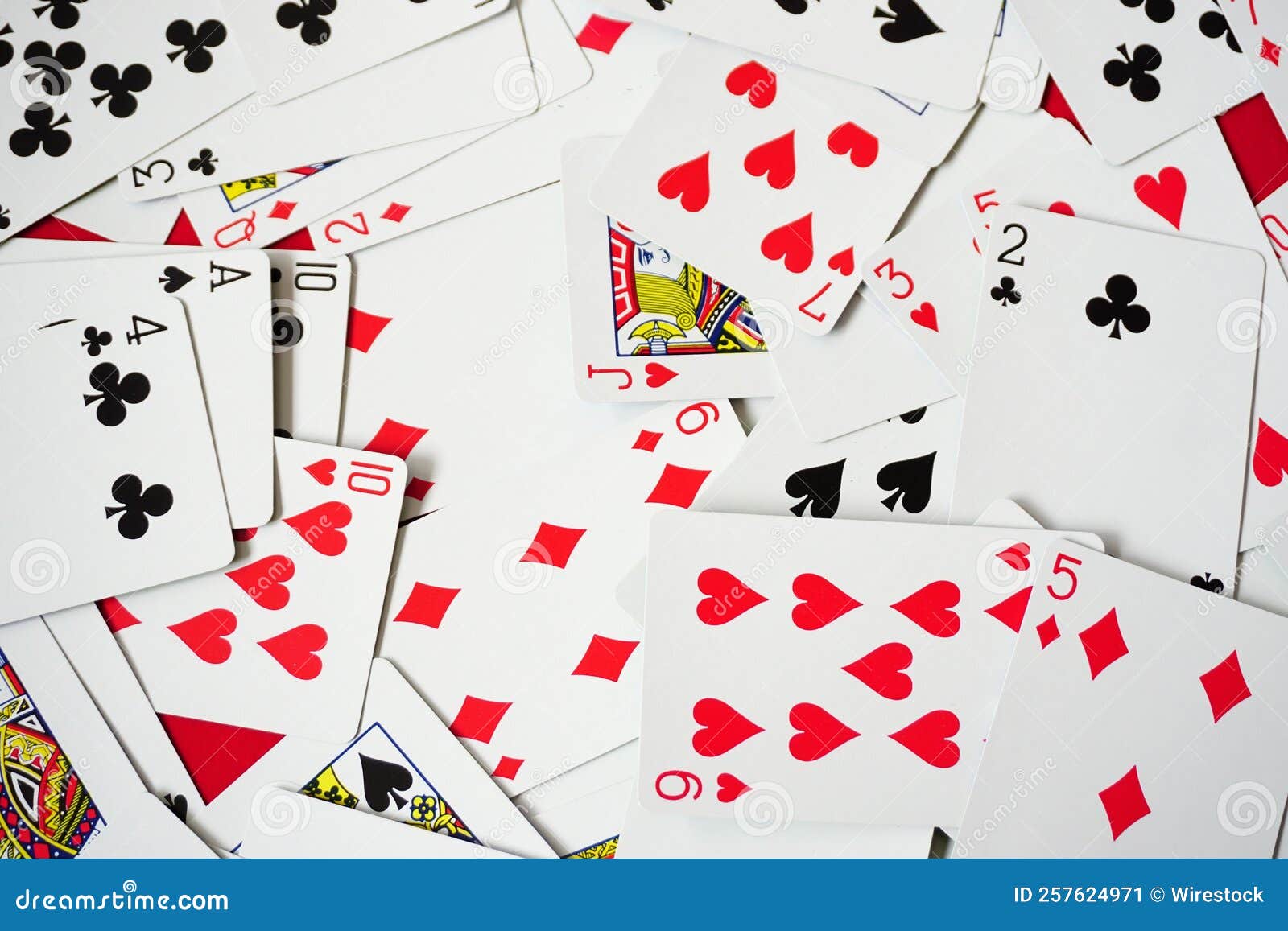 Close-up View of a Pile of Playing Cards Over the White Surface ...